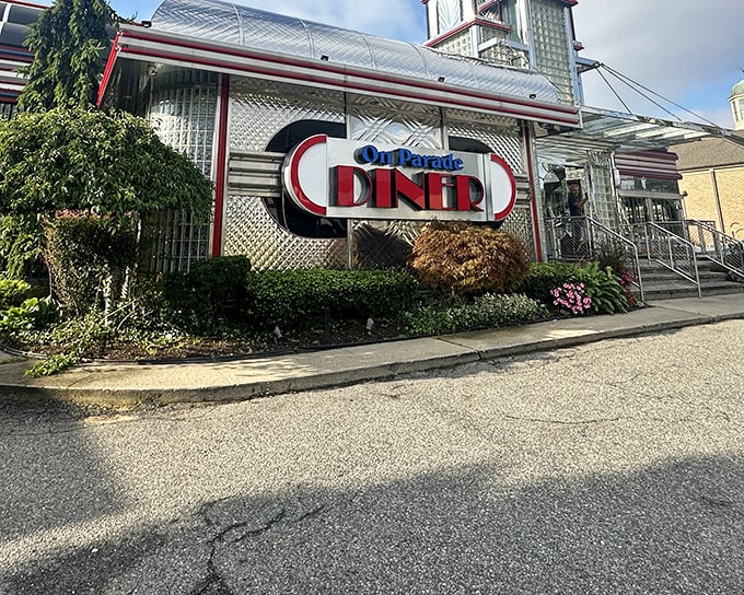 The gleaming chrome exterior of On Parade Diner shines like a beacon of hope for hungry travelers. Classic Americana at its finest.