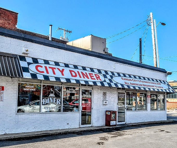 The classic black-and-white checkered awning of City Diner stands as a beacon of breakfast hope on Kansas City's horizon.