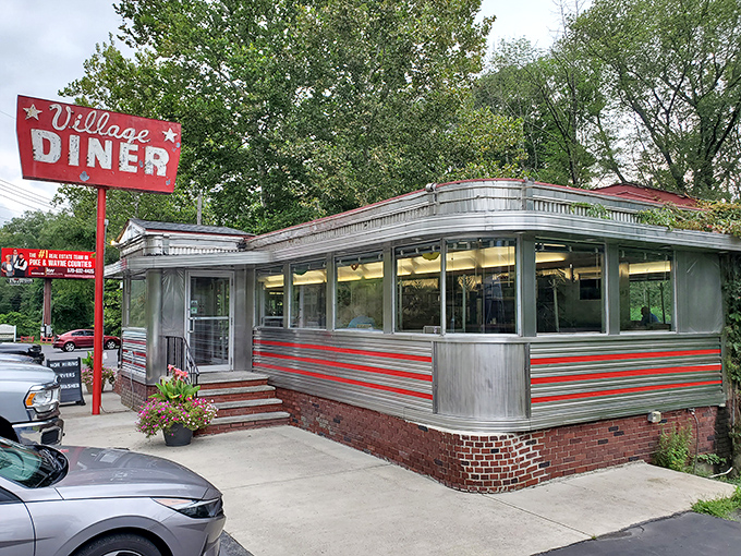 Step back in time with this perfectly preserved slice of Americana, complete with red striping, gleaming stainless steel, and those charming teal umbrellas for outdoor dining.