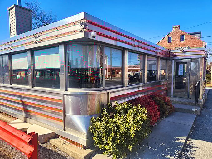 The classic stainless steel exterior of Neptune Diner gleams in the sunlight, a chrome-clad time capsule promising comfort food that hugs your soul.
