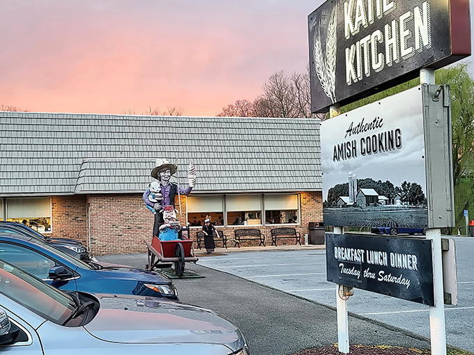 Katie's Kitchen glows at sunset, its sign promising "Authentic Amish Cooking" &ndash; a beacon for hungry travelers in Ronks, Pennsylvania.