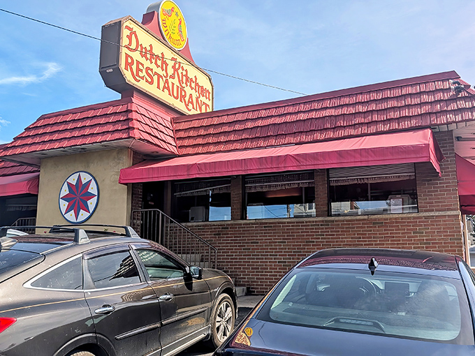 The classic red-roofed exterior of Dutch Kitchen stands like a time capsule on Route 61, complete with Pennsylvania Dutch hex sign welcoming hungry travelers.