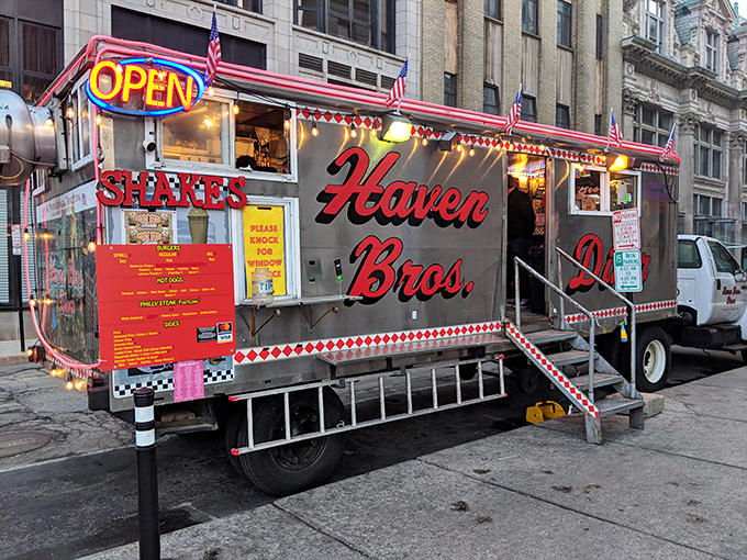 The silver chariot of late-night cravings arrives like clockwork, its neon "OPEN" sign a lighthouse beacon for hungry Providence wanderers.