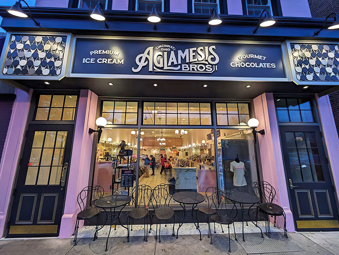 The pink palace of Oakley beckons with its vintage charm. Aglamesis Bros' distinctive fa&ccedil;ade promises sweet treasures within, standing proudly against the Cincinnati sky.