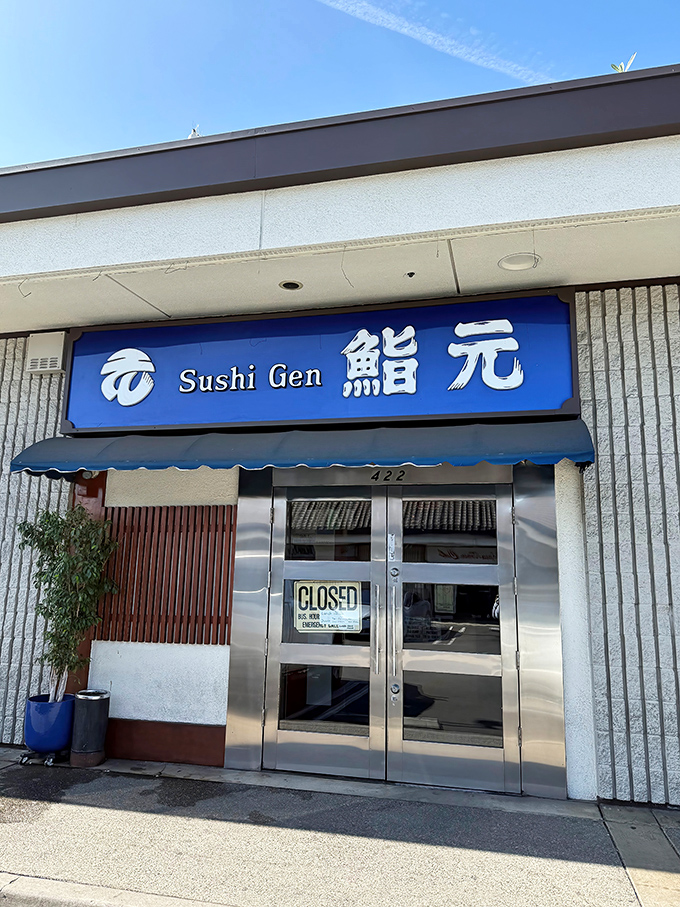 The iconic blue signage of Sushi Gen stands out like a beacon in Little Tokyo, promising seafood treasures within those unassuming walls.
