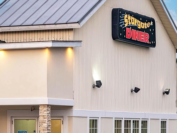 The welcoming exterior of Stargate Diner stands like a beacon of breakfast hope in Seaford. Red trim and ample windows promise good things inside.