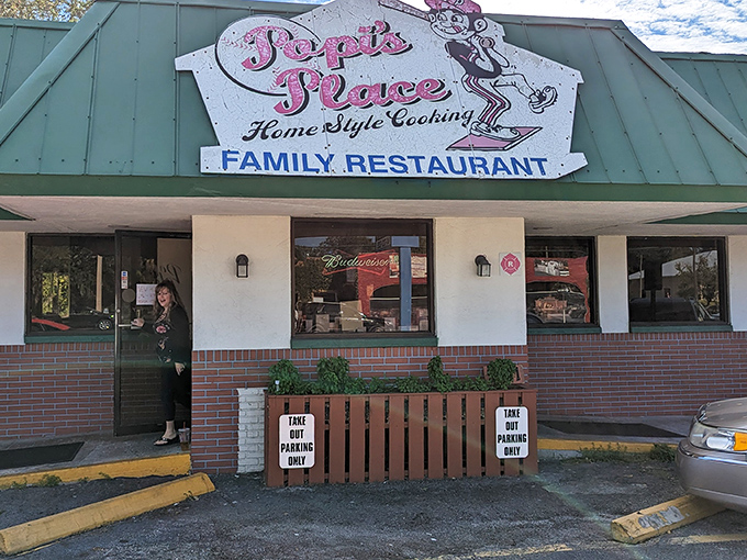The iconic teal roof of Popi's Place IV stands like a beacon for hungry travelers, promising home cooking that delivers on flavor without any pretense.