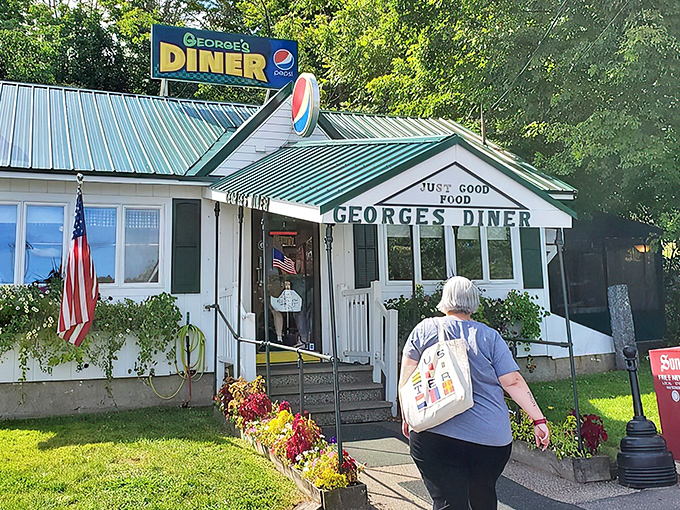 The quintessential New Hampshire diner experience awaits behind that green-trimmed facade. "JUST GOOD FOOD" isn't just a slogan&mdash;it's a solemn promise.