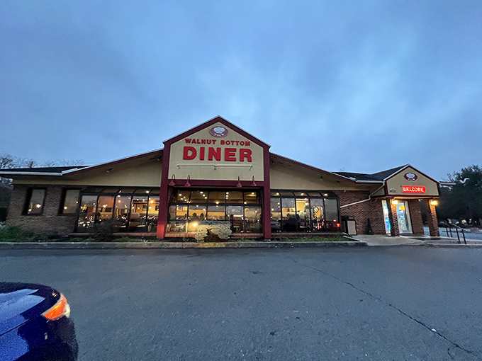 As twilight falls, the diner's warm glow beckons weary travelers like a culinary North Star, transforming an ordinary building into a beacon of breakfast possibilities.