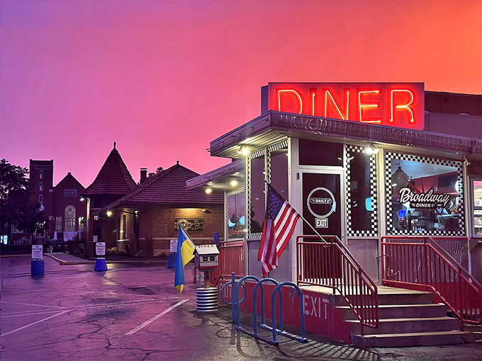 The neon "DINER" sign glows like a beacon against the twilight sky, promising comfort food salvation for hungry souls in Columbia.