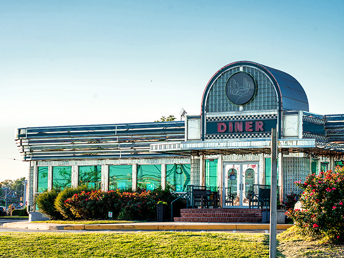Bathed in golden afternoon light, Boulevard Diner's chrome-and-neon fa&ccedil;ade stands as a beacon of comfort food promise against Maryland's blue skies.