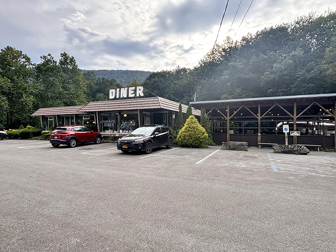 The classic roadside silhouette of Phoenicia Diner stands proudly against the Catskill Mountains, like a time capsule that's somehow both vintage and completely current.