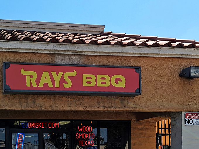 That iconic red and yellow sign beckons like a smoke signal to barbecue pilgrims. The neon promises aren't just marketing&mdash;they're a binding contract with your taste buds.