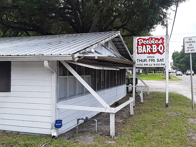 Like stepping into a barbecue time capsule, this no-nonsense exterior promises authenticity over pretension. The metal roof has sheltered smoke-seekers for generations.