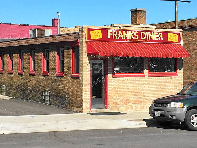That iconic red awning isn't just calling your name—it's practically shouting "breakfast nirvana awaits!" Frank's Diner stands proud against the Wisconsin sky, a beacon of comfort food.