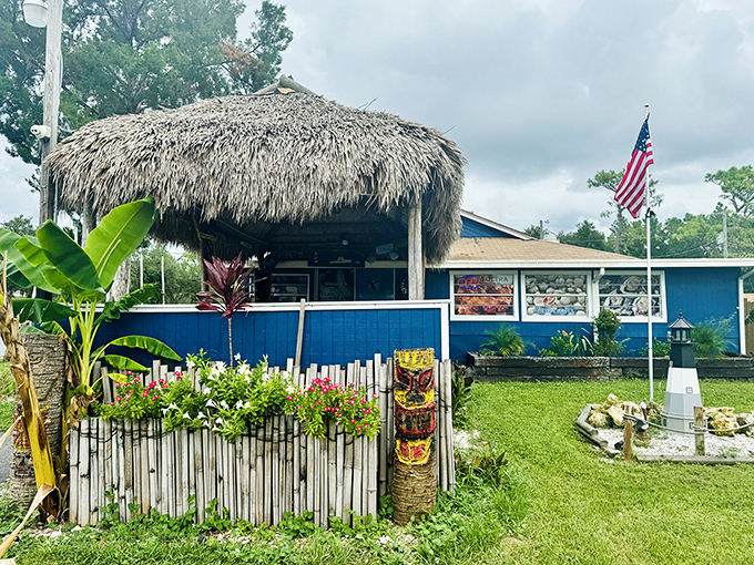 That thatched tiki roof and bright blue exterior aren't just decoration &ndash; they're a promise of seafood paradise ahead.