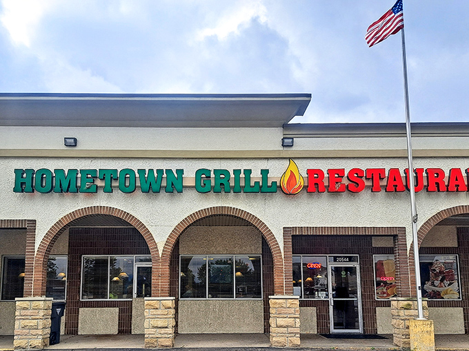 The unassuming exterior of Hometown Grill belies the culinary treasures within. Like finding a diamond in a strip mall setting.