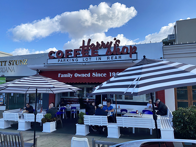 The iconic red signage of Harry's Coffee Shop stands as a beacon of breakfast hope in La Jolla, promising comfort food that's stood the test of time.