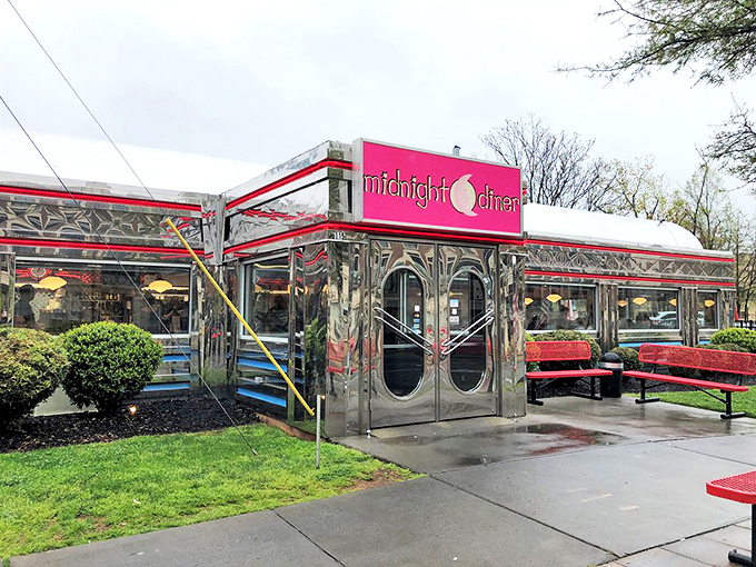 The gleaming stainless steel exterior of Midnight Diner shines like a beacon for hungry souls, its iconic red sign promising comfort food salvation at any hour.