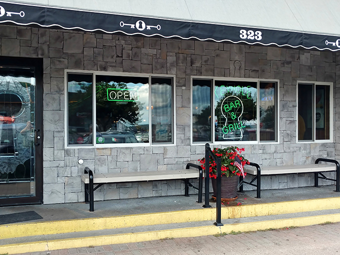 The unassuming stone facade of Keyhole Bar & Grill beckons like an old friend, with its neon "OPEN" sign promising good times and better food inside.