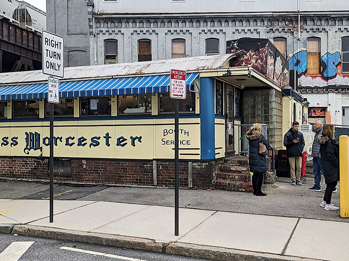 Even on a chilly day, loyal customers queue outside this historic Worcester Lunch Car, proving some things are absolutely worth the wait.