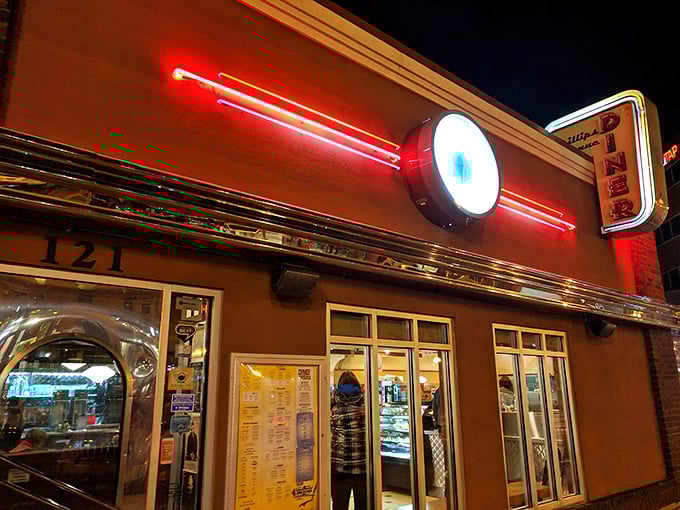 The neon glow beckons like a lighthouse for hungry souls. Phillips Avenue Diner's iconic facade promises retro comfort in downtown Sioux Falls.