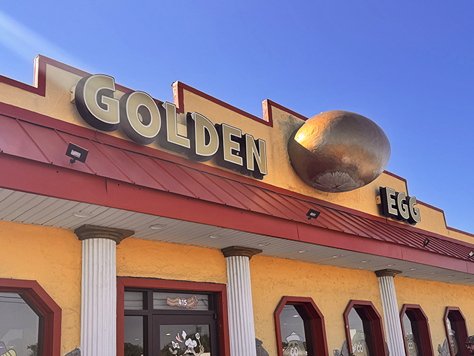 The iconic golden egg perched atop this sunshine-yellow building isn't subtle &ndash; it's basically breakfast's version of the Bat-Signal for hungry humans.