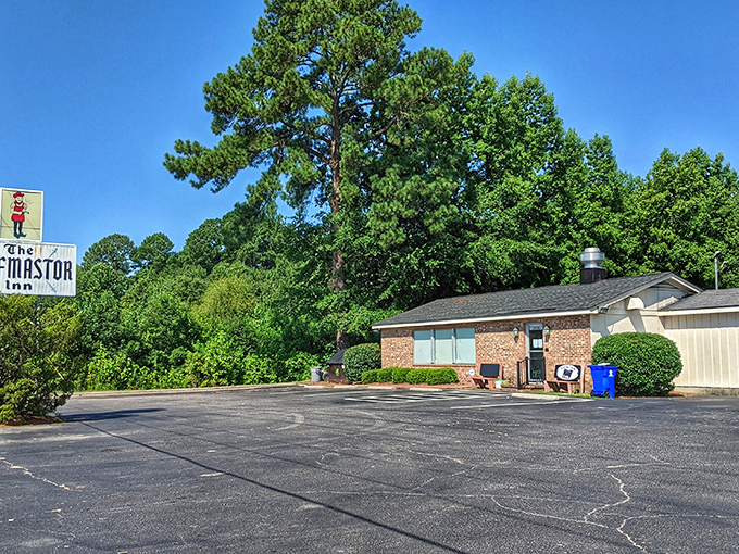 The unassuming entrance to flavor paradise. This brick facade with its modest sign hides one of North Carolina's most celebrated culinary treasures.