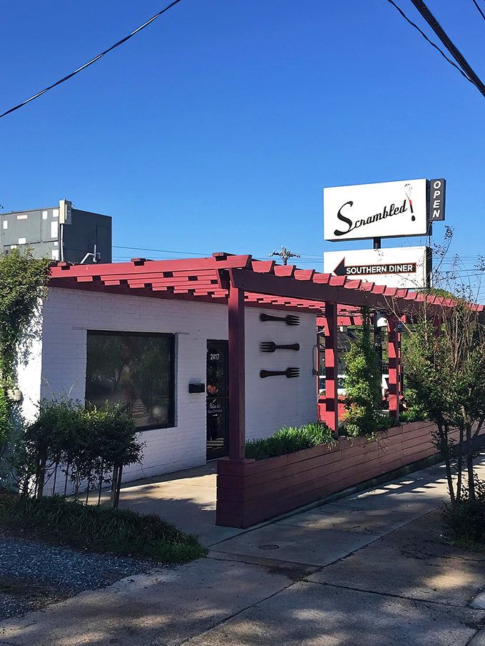 That striking red pergola isn't just architectural flair—it's your beacon to breakfast paradise in downtown Greensboro.