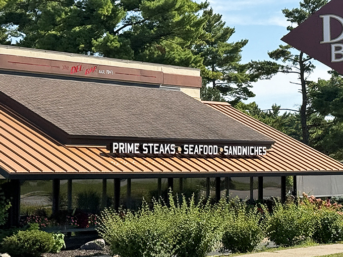 The Del-Bar's distinctive Prairie-style architecture stands as a beacon for steak lovers, promising culinary salvation amid Wisconsin Dells' waterpark wilderness.