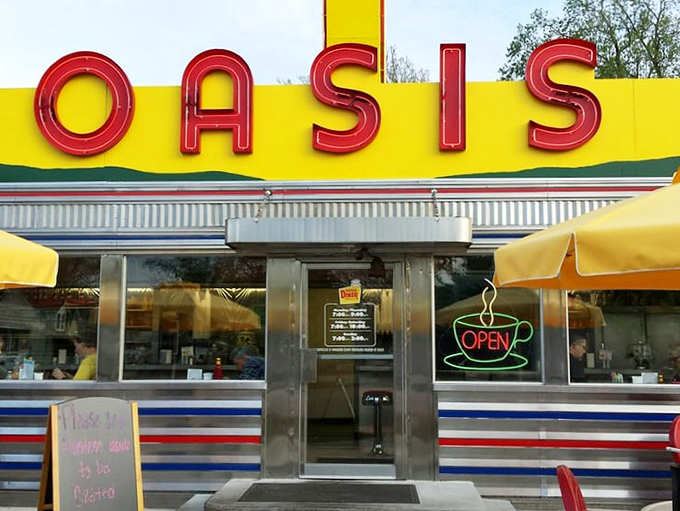 The neon glow of that "OPEN" sign might as well say "HAPPINESS SERVED HERE"&mdash;a portal to simpler times when coffee was endless and conversation flowed freely.