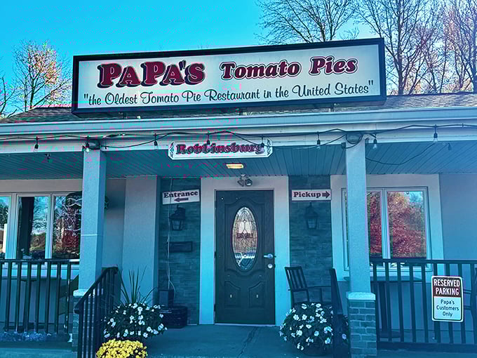 The unassuming storefront that houses pizza history. Papa's proudly declares its heritage with that iconic sign&mdash;pizza pilgrims have been making this journey for generations.