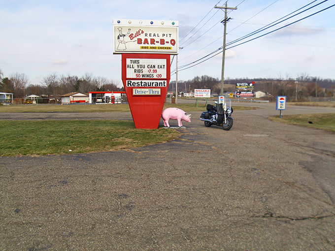 That pink pig by the sign isn't just decoration&mdash;it's a warning to its brethren that deliciousness happens here daily.