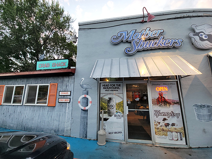 The unmistakable blue exterior of Mother Shuckers, where that giant crab on the roof isn't just decoration&mdash;it's a promise of what awaits inside.