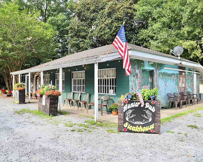The unassuming green exterior of Hunter's Pub & Steakhouse proves once again that culinary treasures often hide in plain sight. That American flag isn't just patriotic&mdash;it's a beacon for hungry travelers.