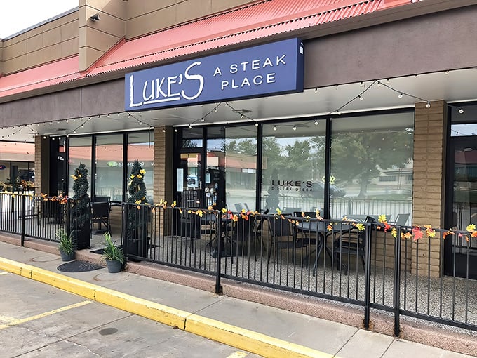 Luke's blue signage beckons from its strip mall home like a lighthouse for hungry souls. The patio's string lights promise casual elegance in suburban Wheat Ridge.