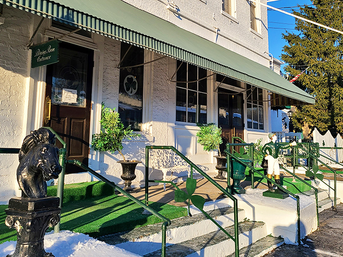 The unassuming exterior of Pat's Steak House, where that bull statue isn't just decoration&mdash;it's a promise of what awaits your plate inside.