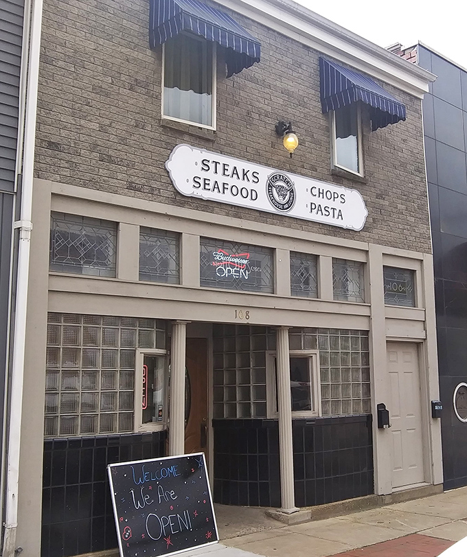 The unassuming brick fa&ccedil;ade of Scratch Steakhouse in Louisville hides culinary treasures within. That striped awning practically whispers, "Come in, carnivores welcome."