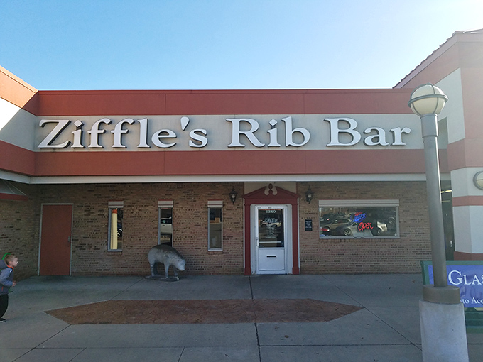 The unassuming exterior of Ziffle's Rib Bar proves once again that barbecue brilliance often hides behind modest facades. Smoke signals of deliciousness await inside.