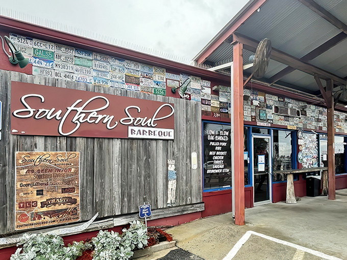 The holy grail of Georgia barbecue beckons with its weathered wood, license plate collage, and that sign promising smoky salvation on St. Simons Island.