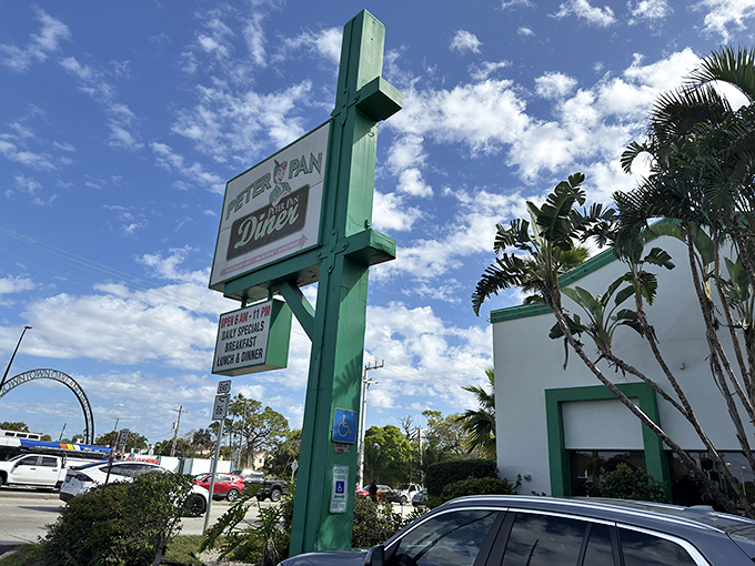 The neon glow of Peter Pan Diner against the Florida night sky isn't just inviting&mdash;it's practically a beacon for breakfast lovers seeking refuge from trendy avocado toast establishments. 