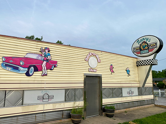 The yellow exterior of Nancy's Main Street Diner is like a time machine with wheels, complete with vintage car murals that practically invite you to roll up in your Thunderbird.