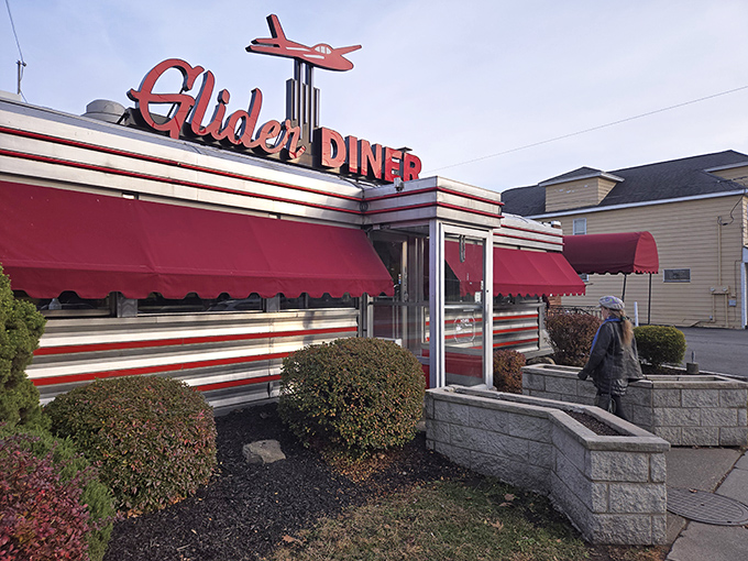 The iconic Glider Diner sign welcomes hungry travelers with its vintage airplane perched proudly above. Classic Americana at its finest!