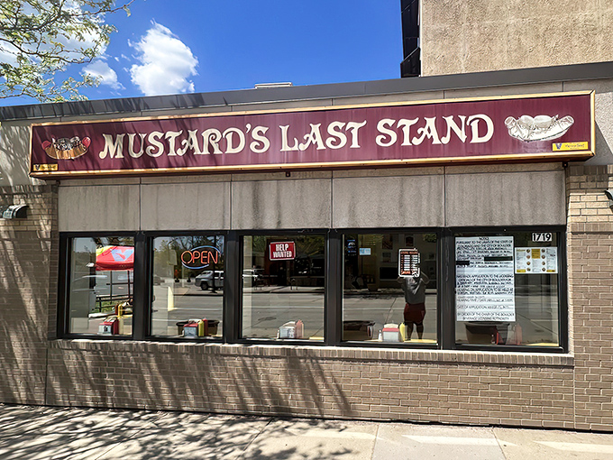 The purple and gold marquee of Mustard's Last Stand stands like a beacon of hope for Chicago dog enthusiasts lost in a sea of kale smoothies.
