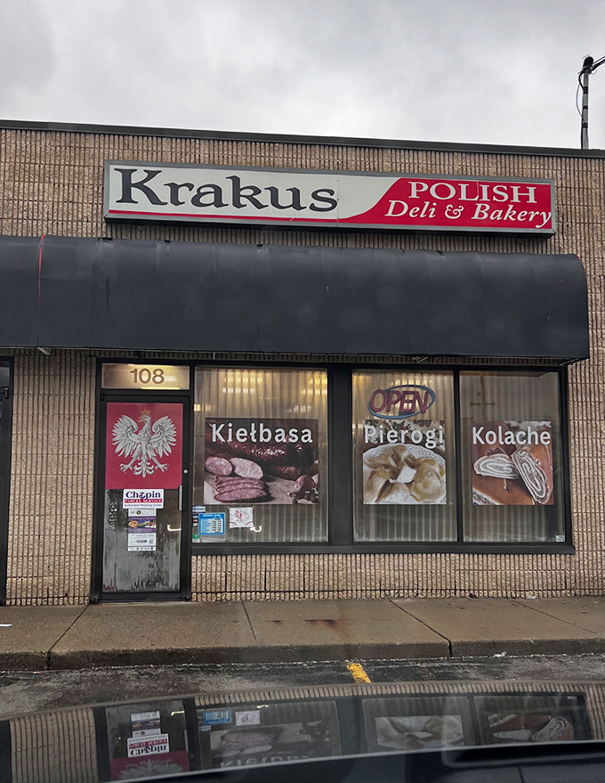 The storefront beckons with promises of authentic Polish delights&mdash;Kielbasa, Pierogi, and Kolache&mdash;each sign a delicious invitation to step inside and taste tradition.