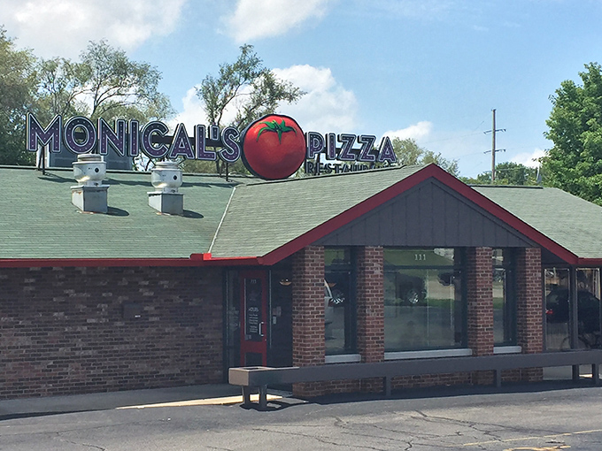 That giant tomato on the roof isn't just decoration&mdash;it's a beacon of hope for the pizza-starved souls of Pekin. No fancy architecture needed when the food speaks this loudly.