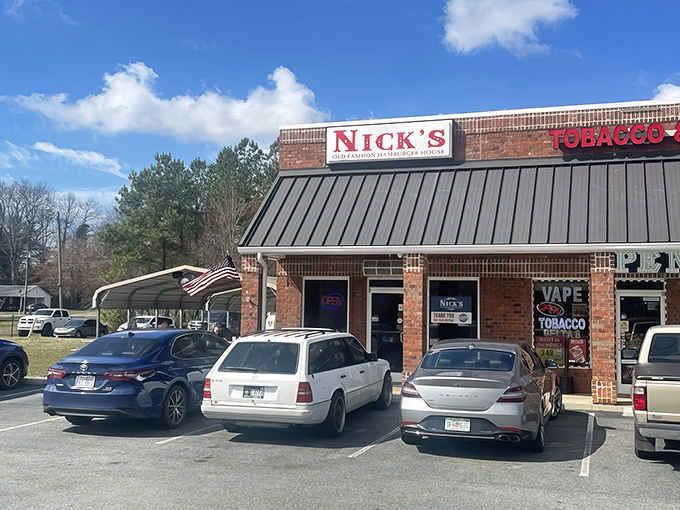 The brick fortress of flavor that is Nick's Old Fashion Hamburger stands proudly against the Carolina blue sky, beckoning hungry travelers with its no-nonsense promise of satisfaction.