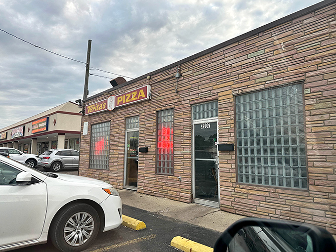 The unassuming stone facade of Terita's Pizza stands like a time capsule on Cleveland Avenue, its vintage sign promising pizza perfection without pretension.