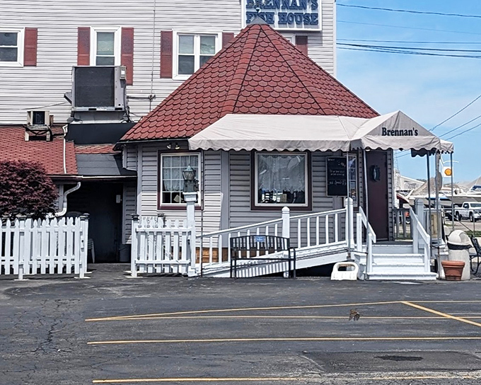 The unassuming exterior of Brennan's Fish House with its distinctive red-tiled roof proves that culinary treasures often hide in plain sight.