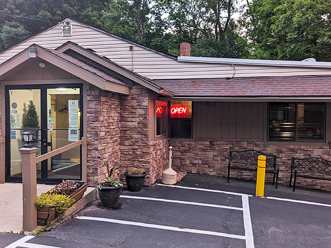 The stone facade of Oak Park Tavern stands like a culinary fortress, its humble "OPEN" sign a beacon for prime rib pilgrims across Ohio.